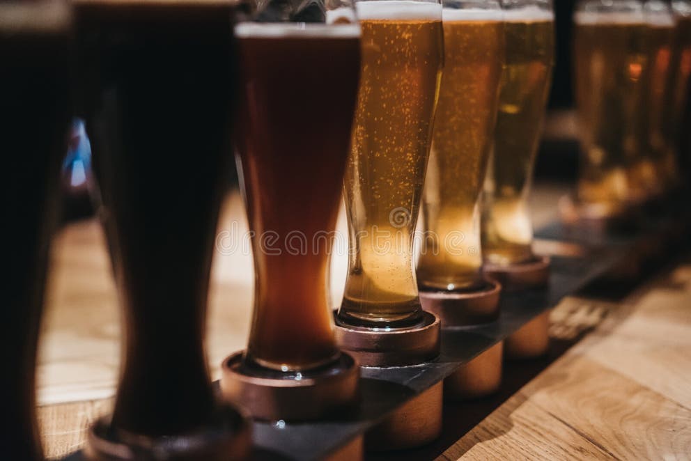 Close Up of a Rack of Different Kinds of Beers, Dark To Light, on a ...