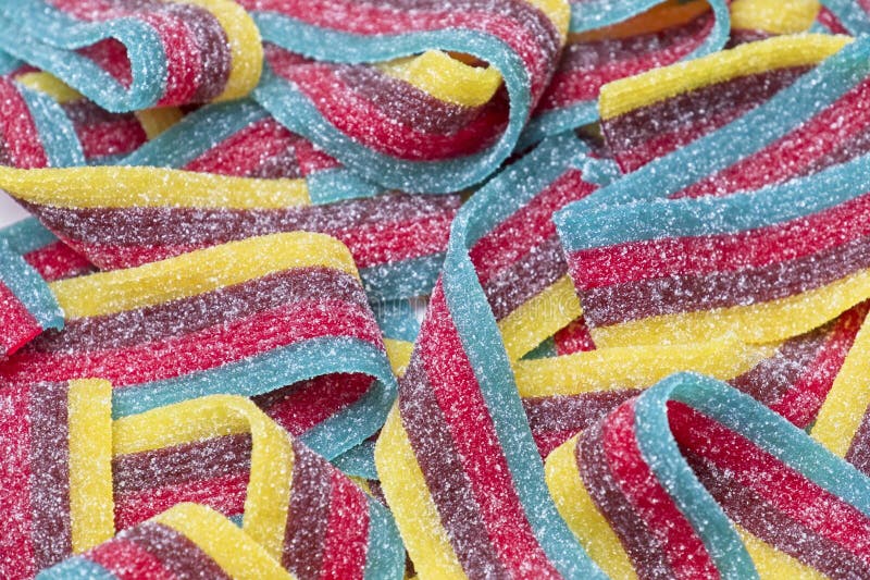 Close Up of Rainbow Colored Sugar Coated Candy Strips Stock Photo ...
