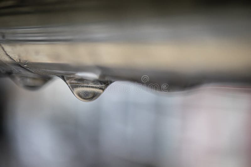 Close Up of Raindrops Hanging from the Iron Railing. Stock Photo ...