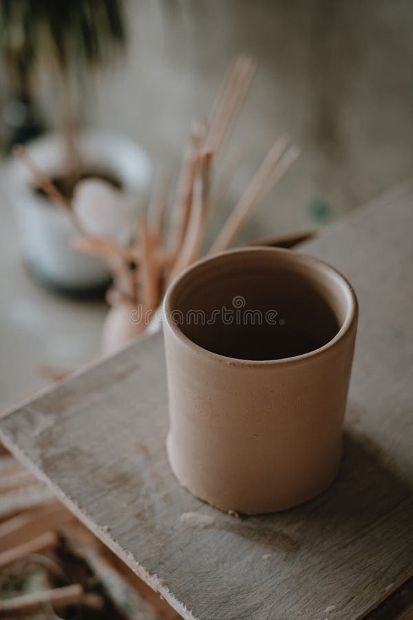 Close-up Raw Ceramic Pottery Cup Drying on Wooden Table, Clay Texture ...