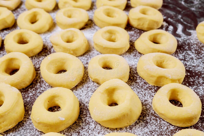 Close Up of Raw Round Donuts on Table with Flour before Frying Stock ...