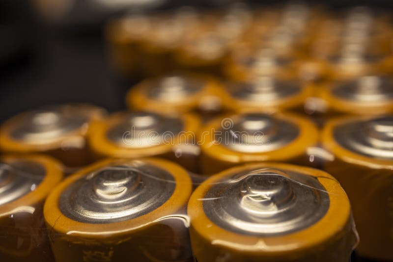Close-up of AA Batteries on a Smooth Surface. Focus on Battery Detail ...