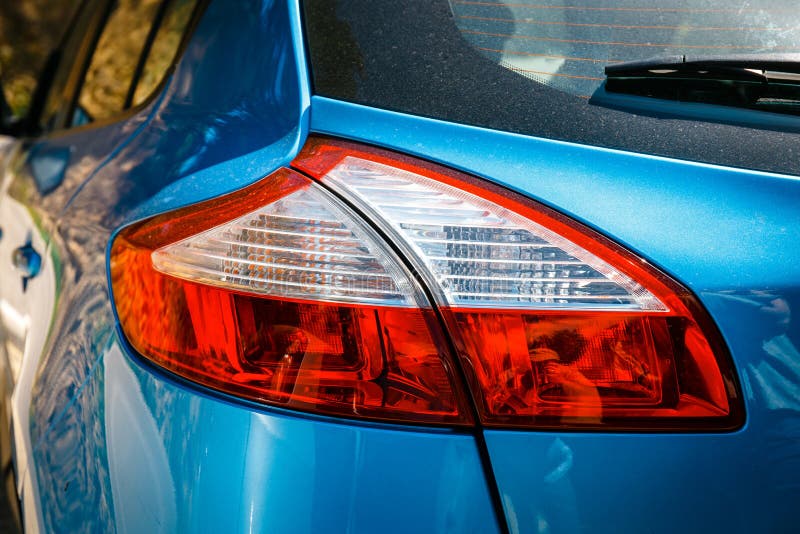 Red Rear Light On A Modern Blue Sport Car With Reflection. The Closeup ...