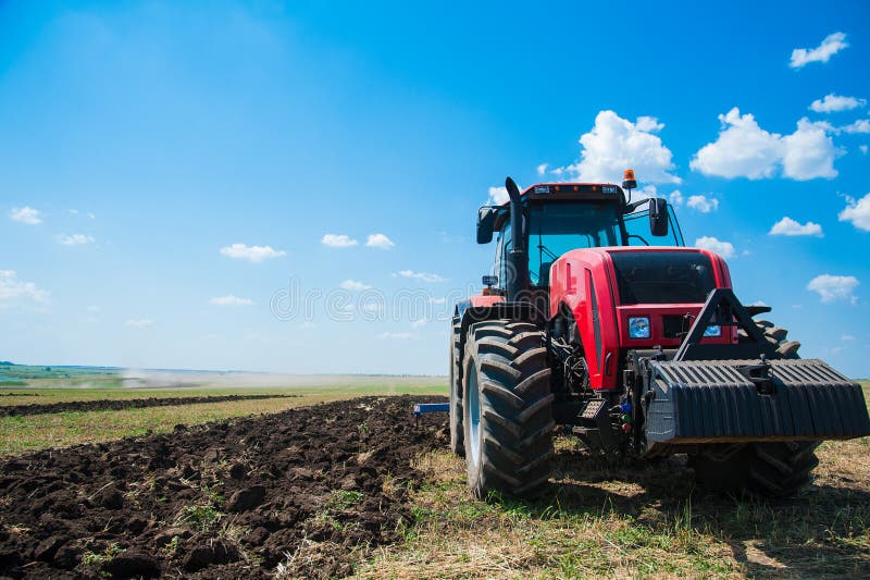 Tractor while plowing stock photo. Image of ploughing - 102824188
