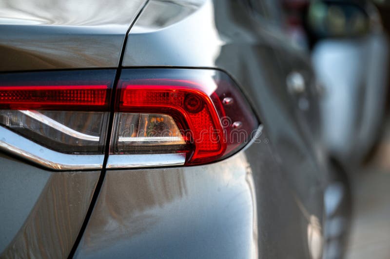 Close-up of the Rear Light of a Silver Car with a Blurred Background ...