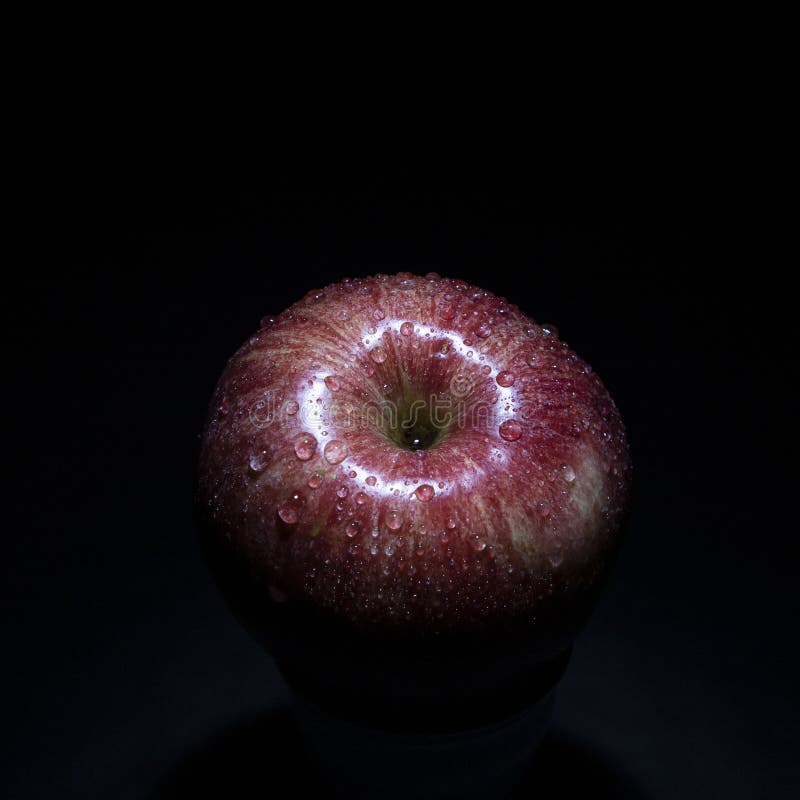 Close-up of a Red Apple, Light from Above, Black Background, Water ...
