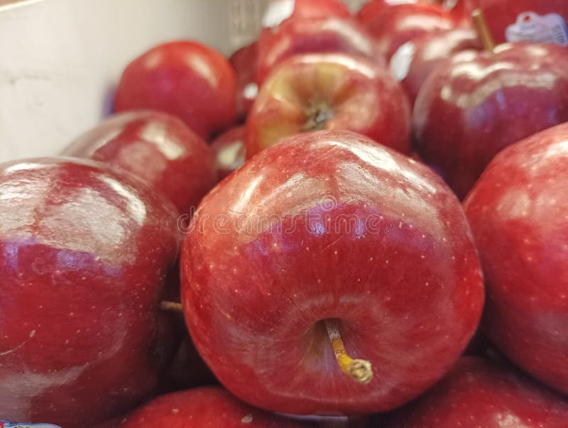 Close-up of Red Apples in a Pile, Showing Texture and Stem Stock Image ...
