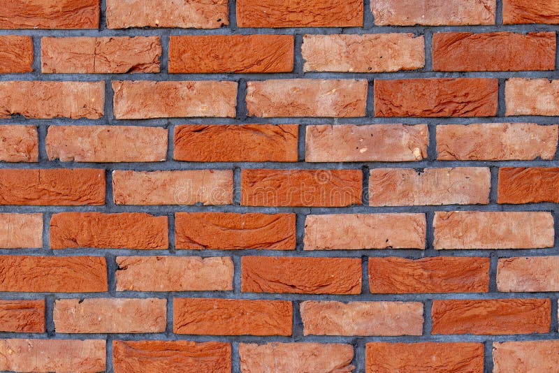 Close-up of a Red Brick Wall with Textured Surface and Dark Mortar ...