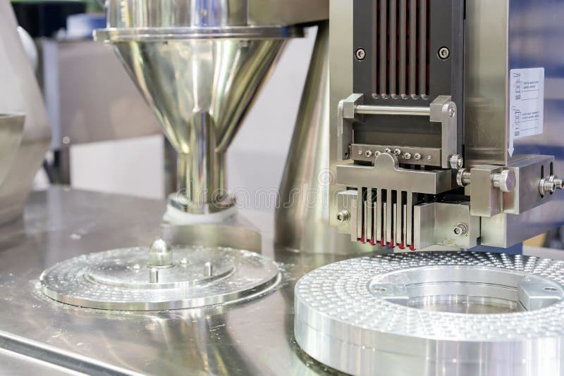 Close Up Red Capsule in Disc Sorting Plate and Feeding Fork of ...