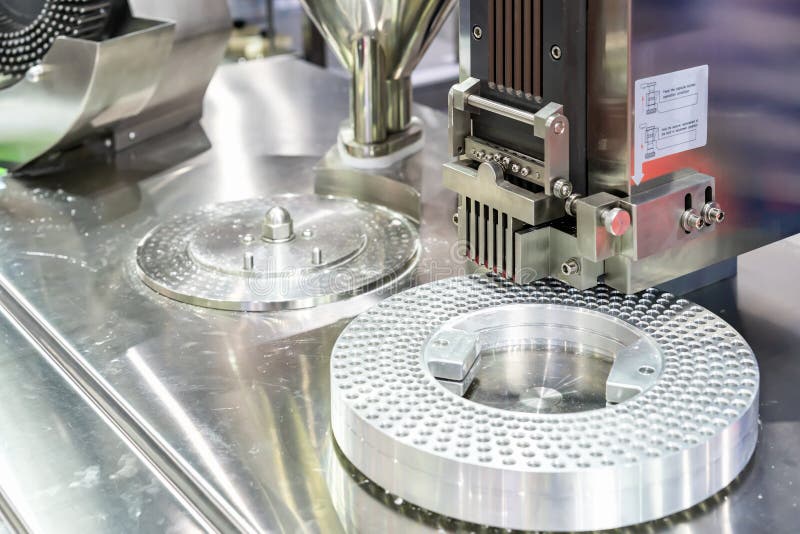 Close Up Red Capsule in Disc Sorting Plate and Feeding Fork of ...