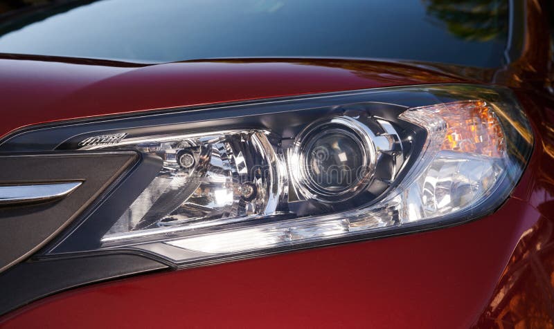 Close Up of Red Car Headlight Stock Image - Image of lamp, reflection ...