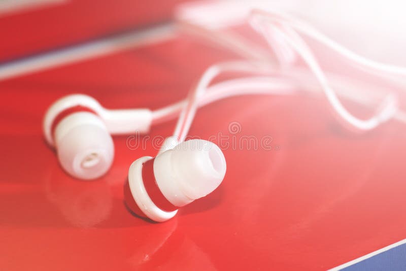 Close Up on Red Earbuds, a Trendy Device for the Player Stock Photo ...