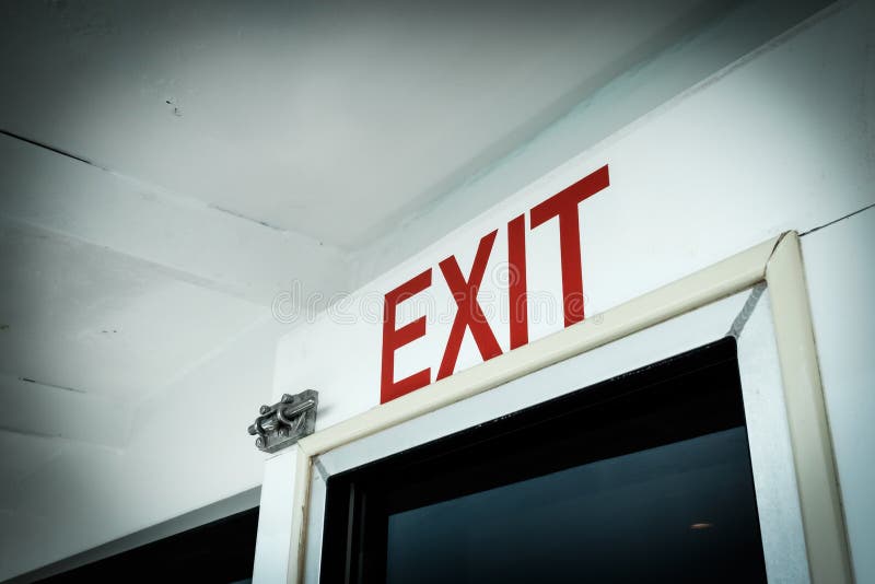 A Close-up Red Exit Directional Sign with White Background Stock Photo ...