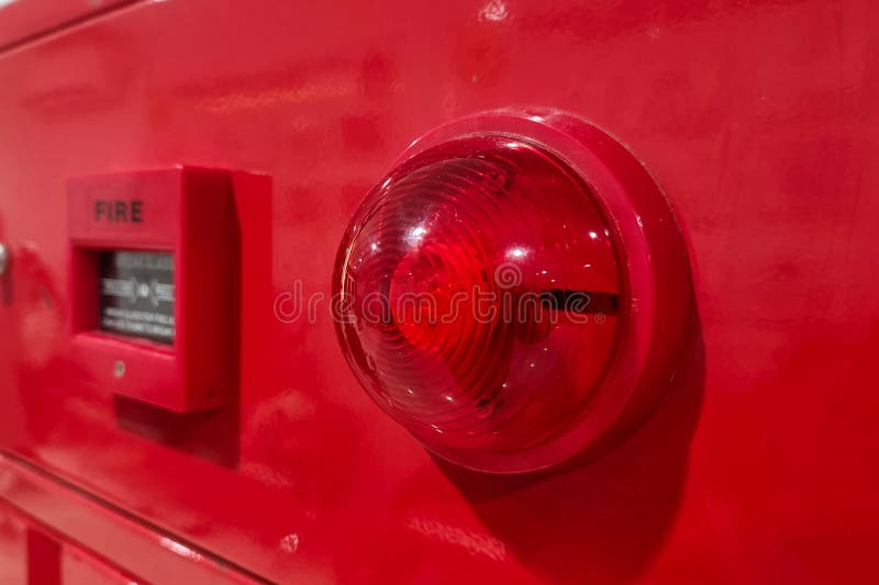 A Close-up of a Red Fire Alarm System with a Warning Light and ...