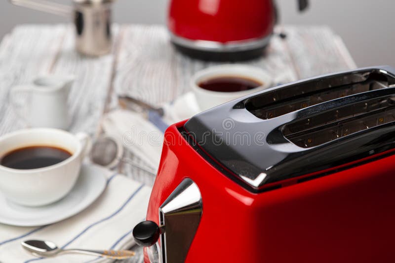 Close Up of Red Kitchen .appliances on Kitchen Table Stock Photo ...