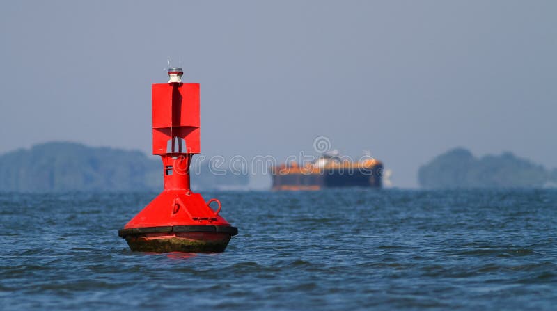 Red Navigational Buoy with Light on Top and Small Solar Panels for ...