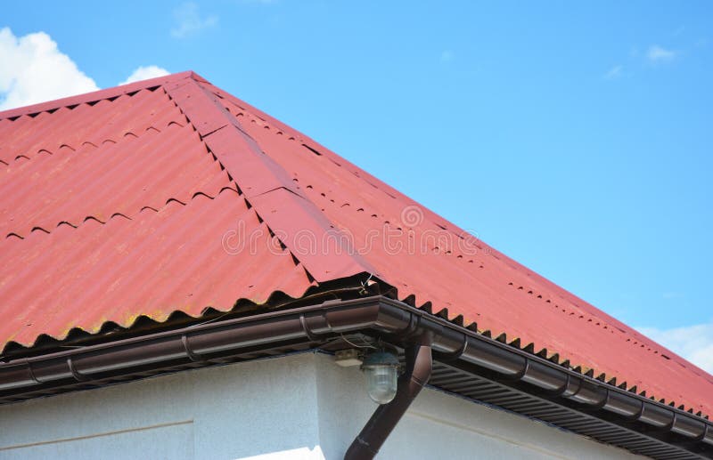 Close Up on Red Roofing Construction House with Roof Gutter System ...