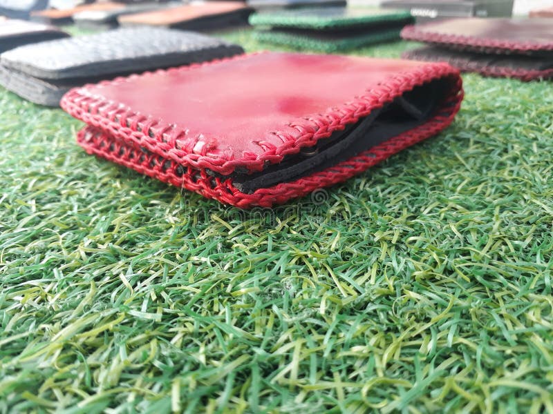 Red wallet on grass stock image. Image of purse, rich - 126229179