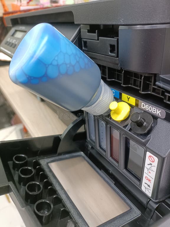 Close-up. Refilling Bule Ink into a Multifunction Printer Stock Photo ...