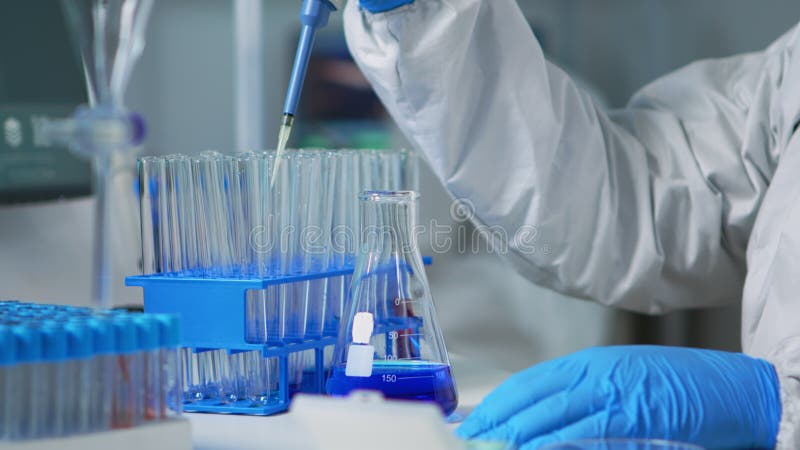 Close Up of Researcher Testing Liquid Sample Using Micropipette Stock ...