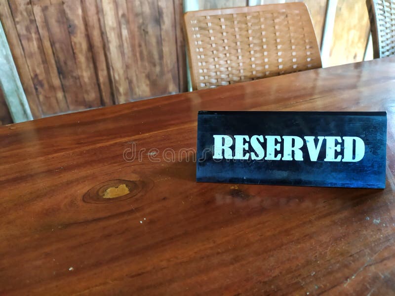 Close-up on a Reserved Sign on a Table at a Restaurant Stock Photo ...