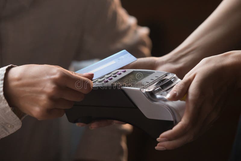 Close Up of Client Paying with Card Using Nfc Method Stock Photo ...