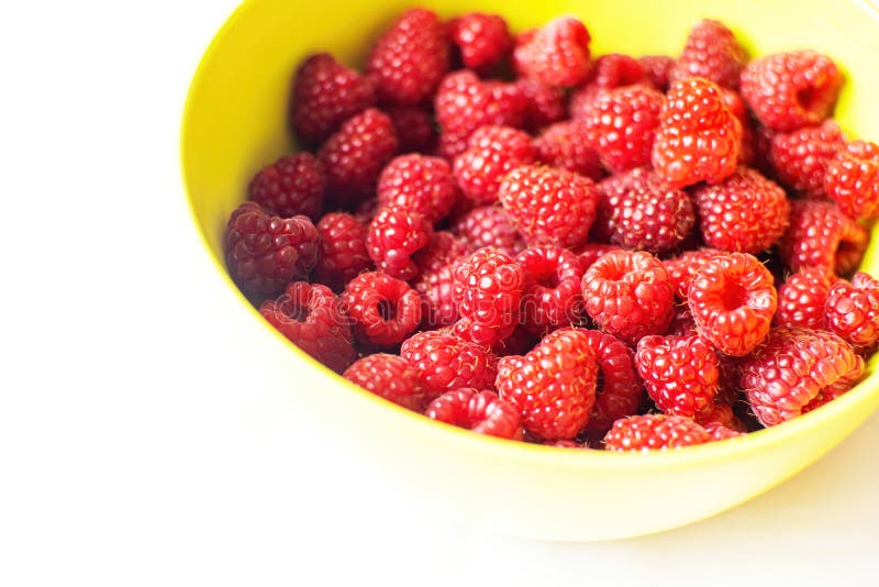 Close-up of Ripe Raspberry Fruits on a Bamboo Plate on the Table Stock ...