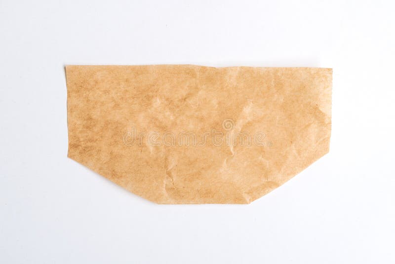 Close Up of a Ripped Piece of Brown Paper on White Background Stock ...