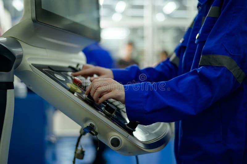 Close Up Of Robotics Engineers Using Controller To Remotely Operate