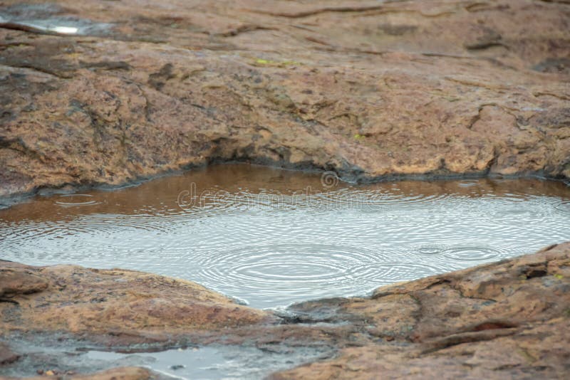 Rock Pool with Ripples from Rain Stock Image - Image of rocks, raining ...