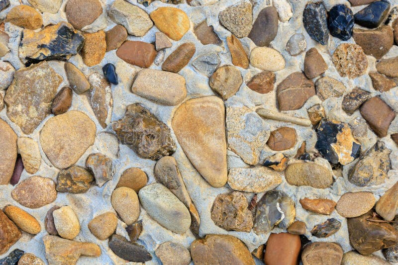 A Close Up of a Rock Wall with Many Different Sized Rocks Stock Photo ...