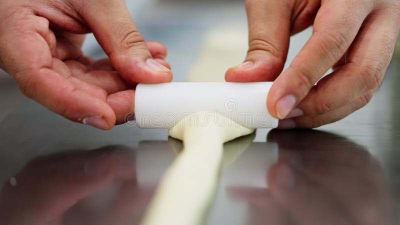 Close-up of Rolling Bread Dough To Make it Flat, Showcasing the Hands ...