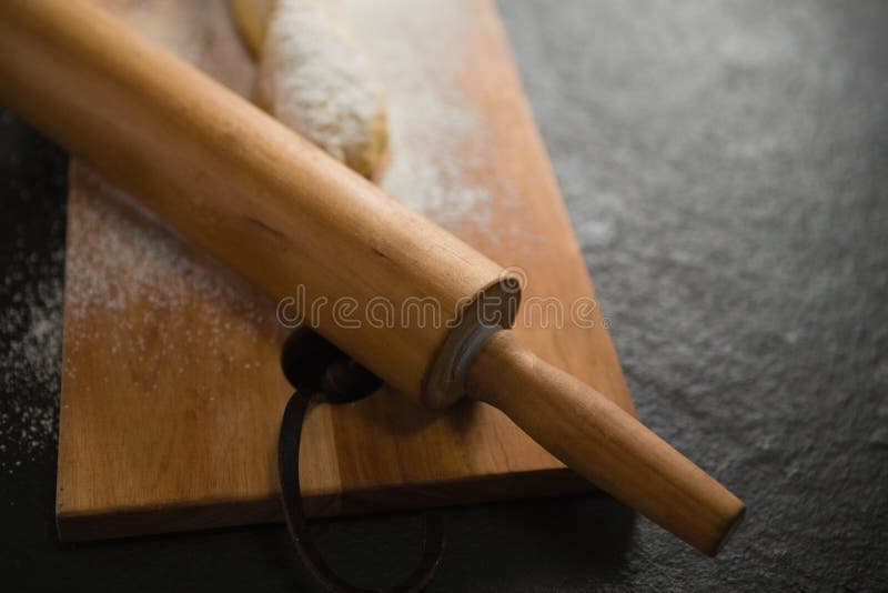 Close Up of Rolling Pin on Cutting Board Stock Photo - Image of rolling ...