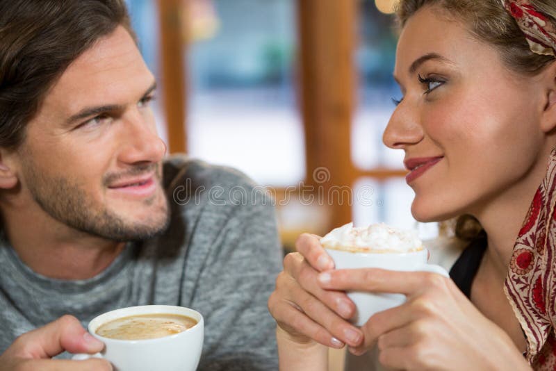 Close-up of Romantic Couple Having Coffee in Cafeteria Stock Photo ...
