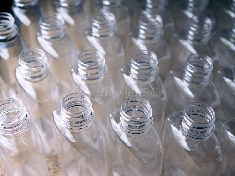 Close Up Row of Plastic Drink Water Bottles for Filling Process Stock ...