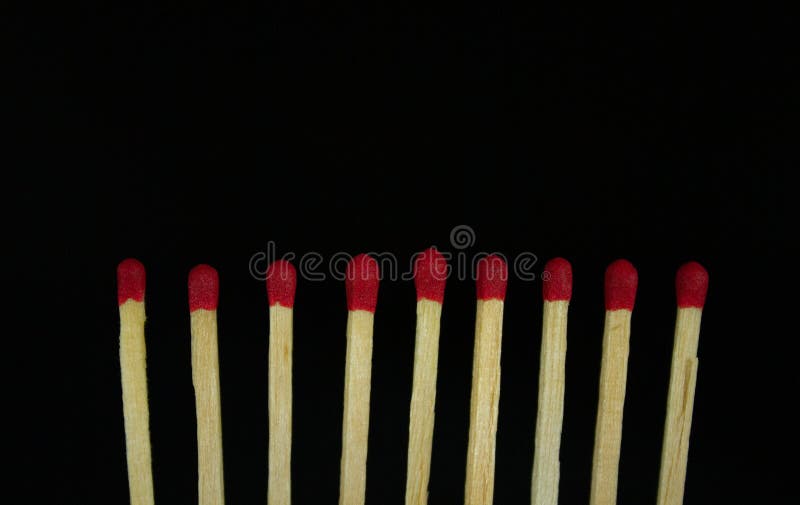 Close Up Row of Red Matches Isolated on Black Background with Copy ...