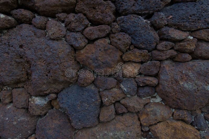A Close-up of a Rugged Stone Wall Stock Image - Image of tones, rugged ...