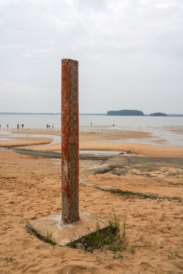 Close-up of a Ruler Measuring Water Depth on the Beach at the Seaside ...