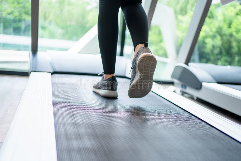 Close-up of Runner`s Feet on a Treadmill in a Gym Stock Image - Image ...