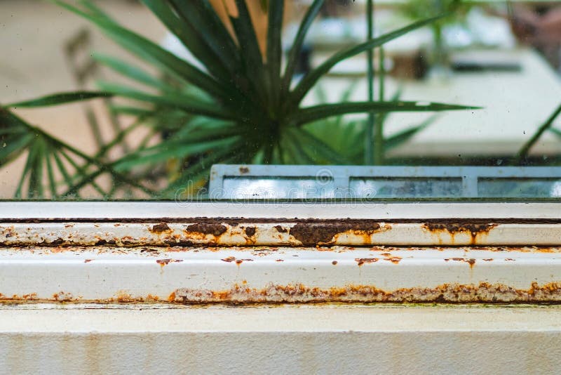 Close Up of Rust on Old White Iron Window Sill with a Blurred ...