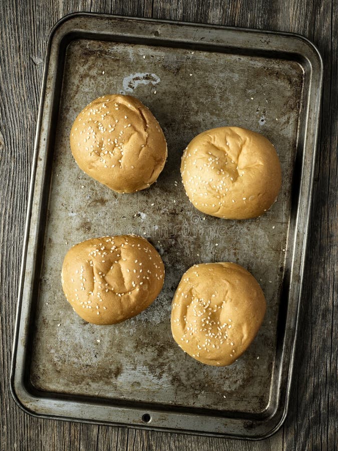 Rustic hamburger bun stock photo. Image of cooked, seed - 99622078