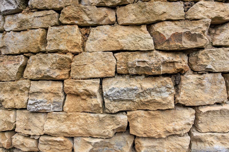 Close-up of Rustic Stone Wall with Uneven Textures and Earthy Tones ...