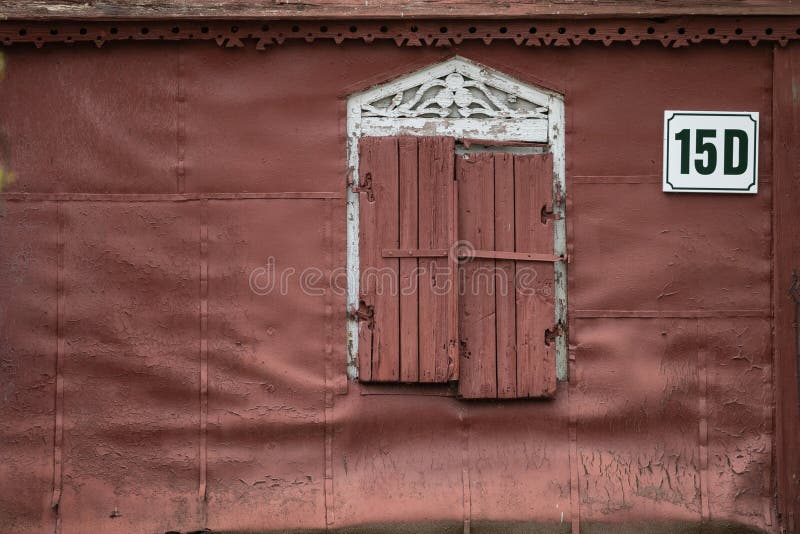 Old Wooden Shuttered Window on Rusty Metal-Clad House in Vilkpede ...