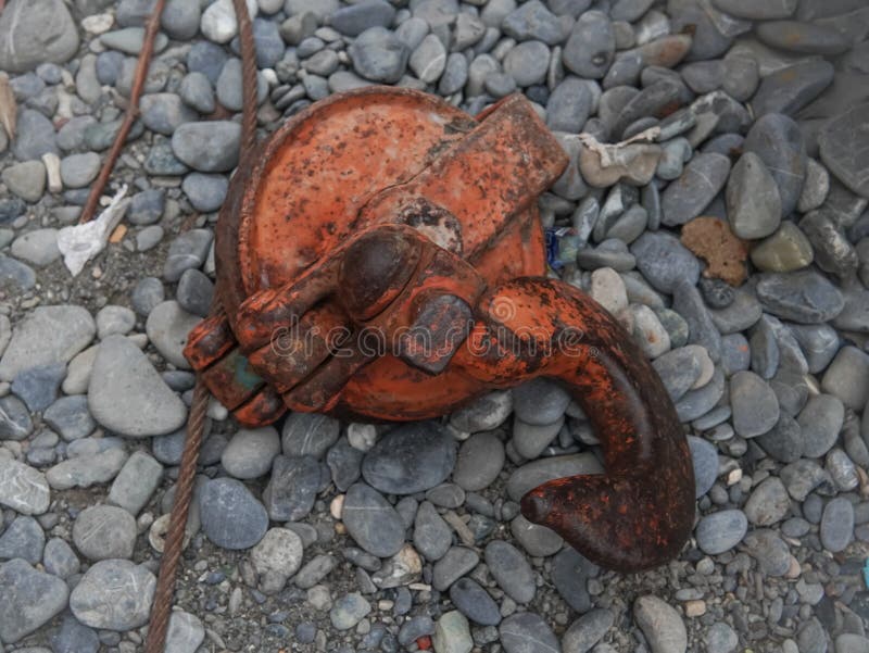 Close Up of Rusty Anchor on Stone Background on the Seashore Stock ...