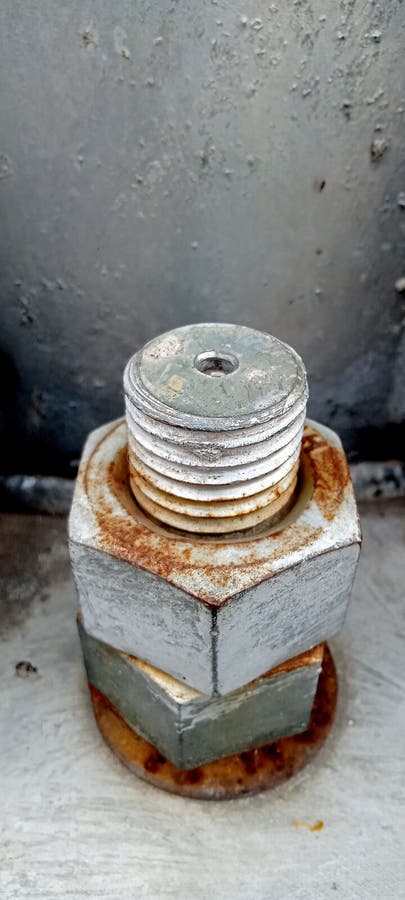 Close Up of a Rusty Looking Bolt and Nut, the Smaller Bolt is on Top of ...