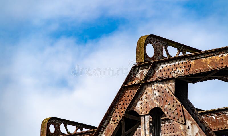 Old Rusty Iron Bridge Structure Set Against Blue Sky Stock Image ...