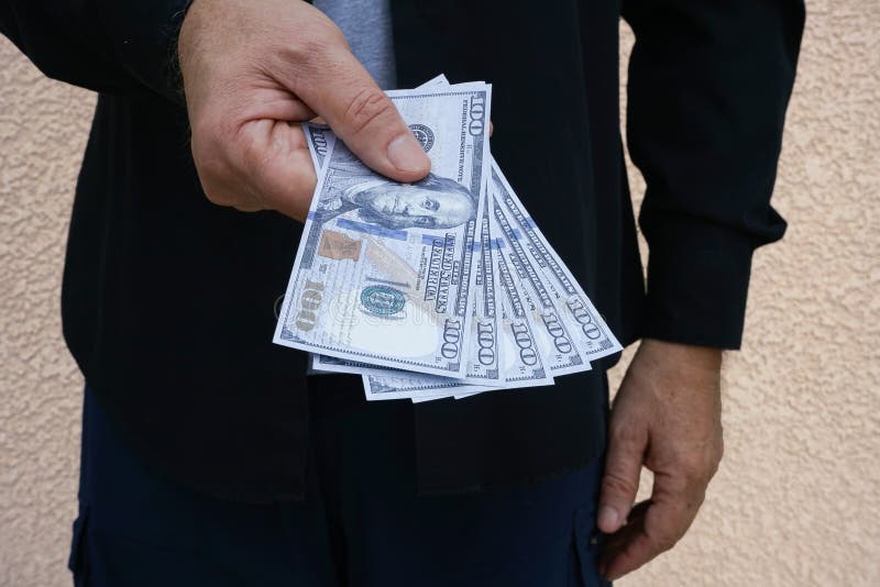 Close Up of Man Handing Over Stack of 100 Dollar Bills. Stock Image ...