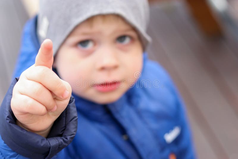 Close Up of a Sad Little Boy Pointing with a Finger Stock Image - Image ...