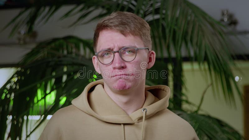 Close-up of a Sad Young Man with Glasses and Pimples on His Face ...