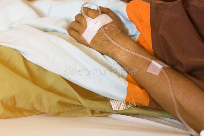 Close Up of Saline Solution on Hand of Man Patient Lying on the Stock ...